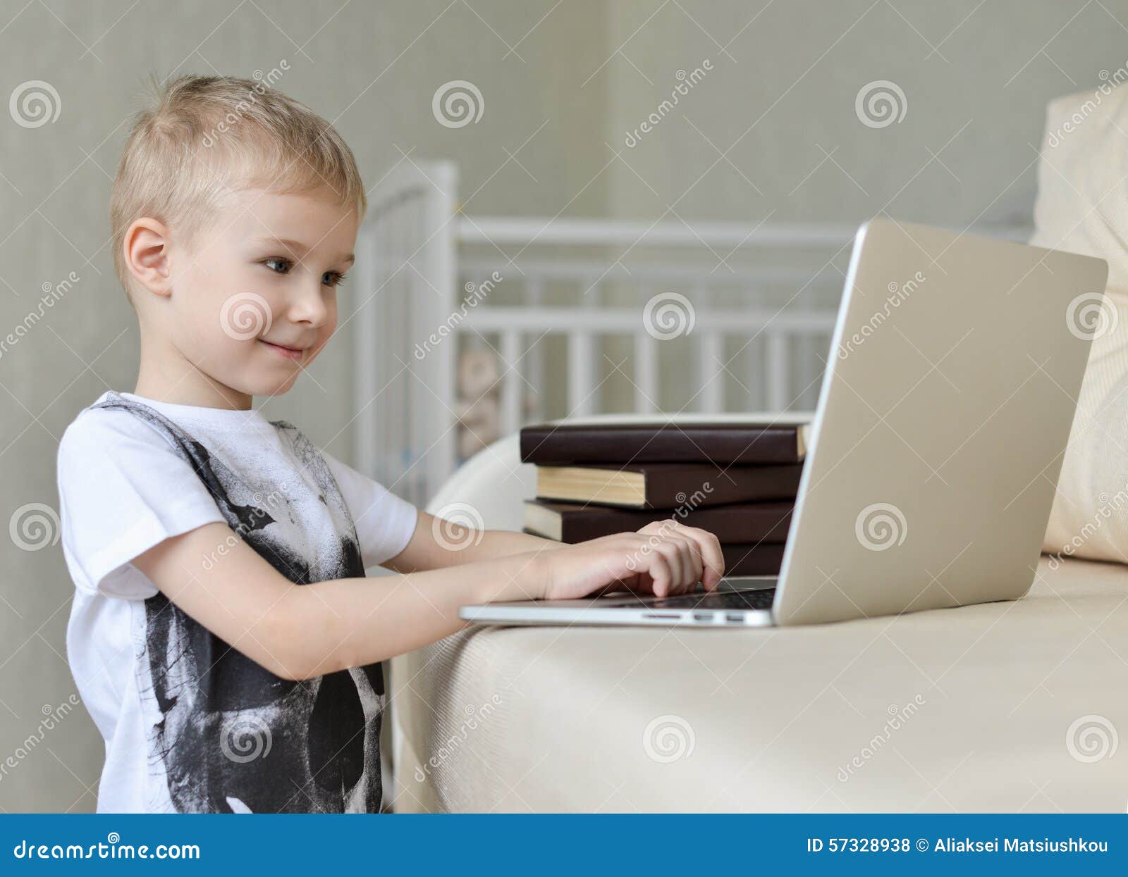 Little Boy Sitting with Laptop on the Couch at Home Stock Photo - Image ...