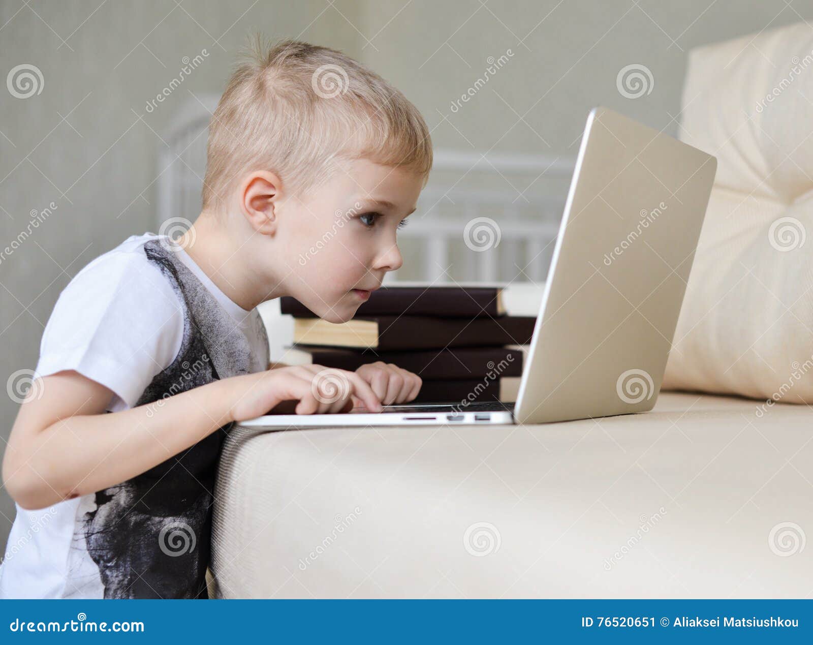 Little Boy Sitting with Laptop on the Couch at Home Stock Image - Image ...