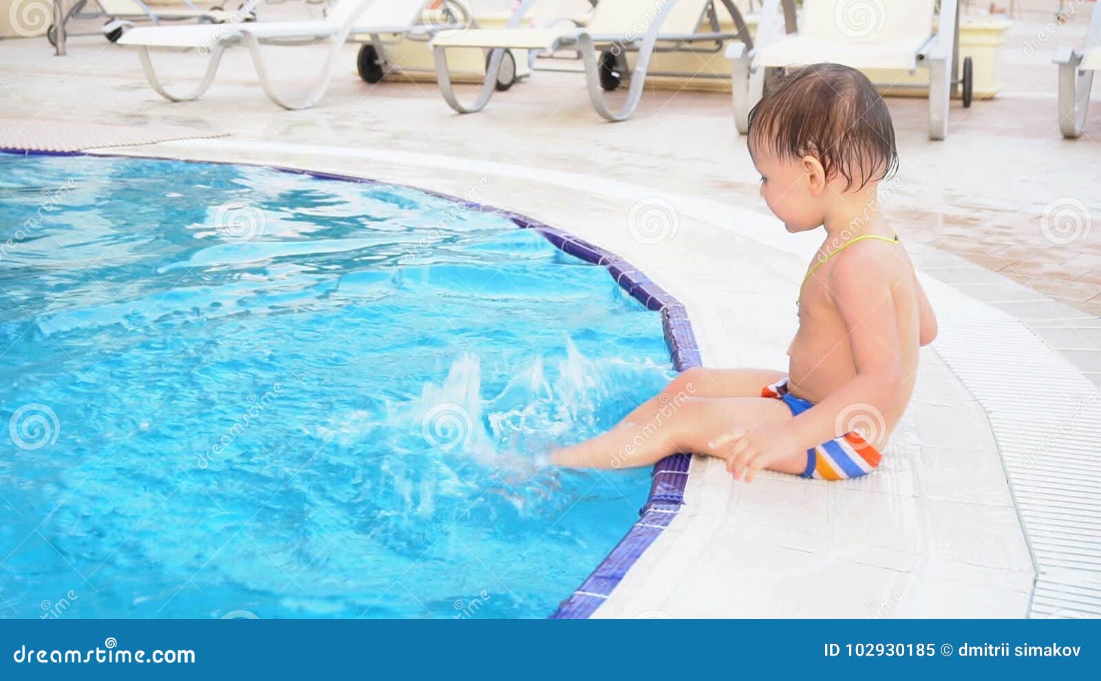 The Little Boy is Sitting Poolside at the Resort Stock Video - Video of ...
