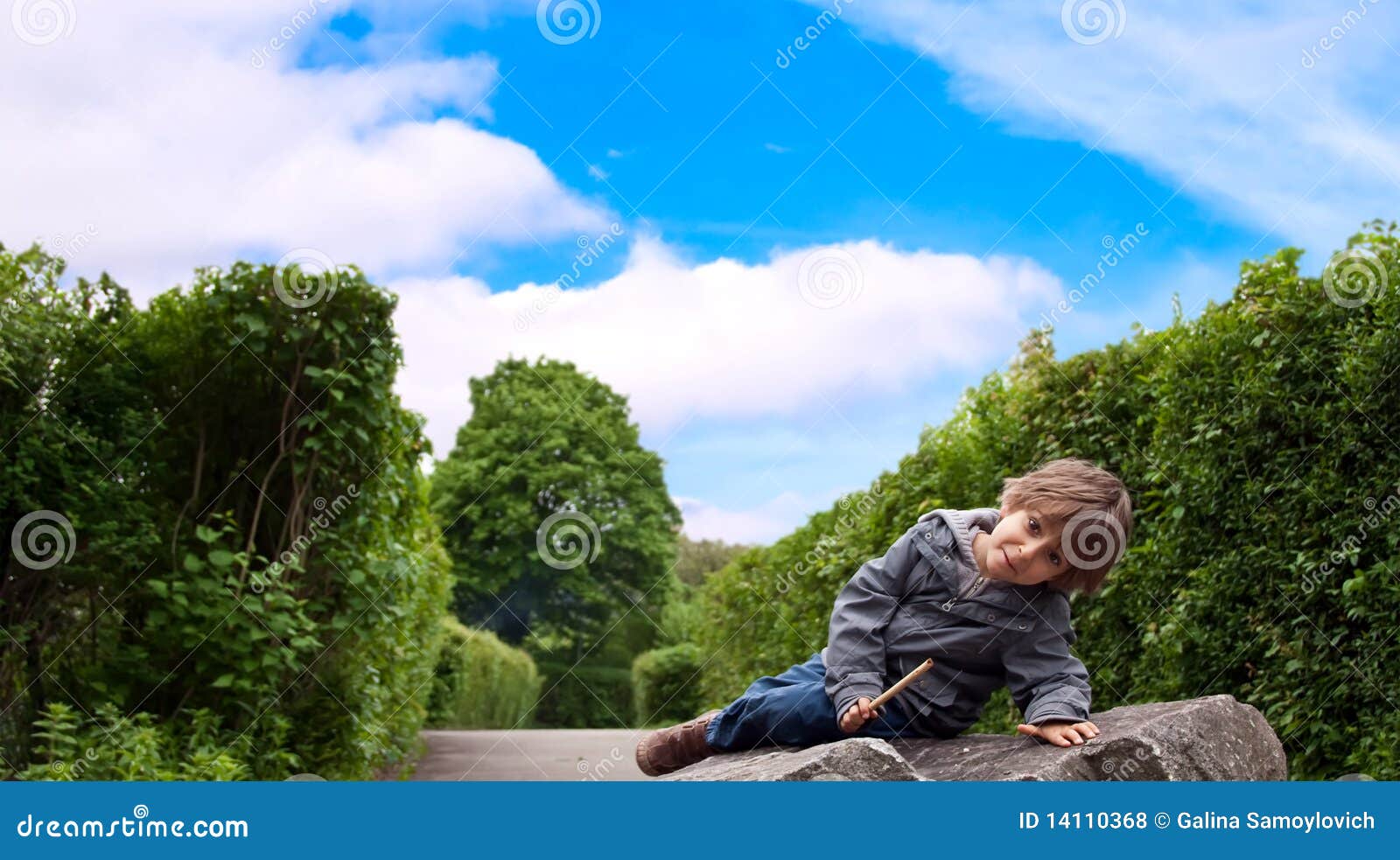 A Little Boy Sitting on a Rock. Stock Photo - Image of young, sunny ...