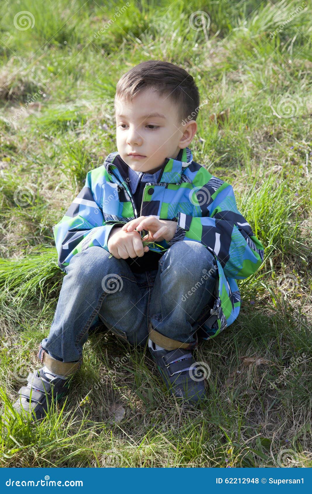 Little boy sitting and sad stock photo. Image of park - 62212948