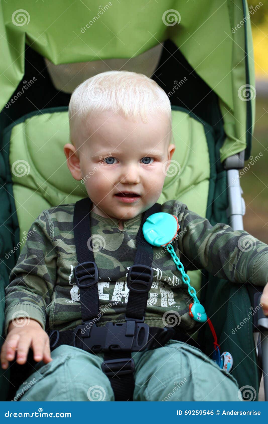 Little Boy Sitting in Stroller Stock Photo - Image of cute, sitting ...