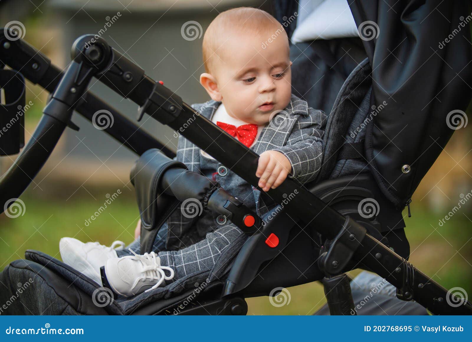 Little Boy Sitting in a Stroller Stock Image - Image of funny, adorable ...