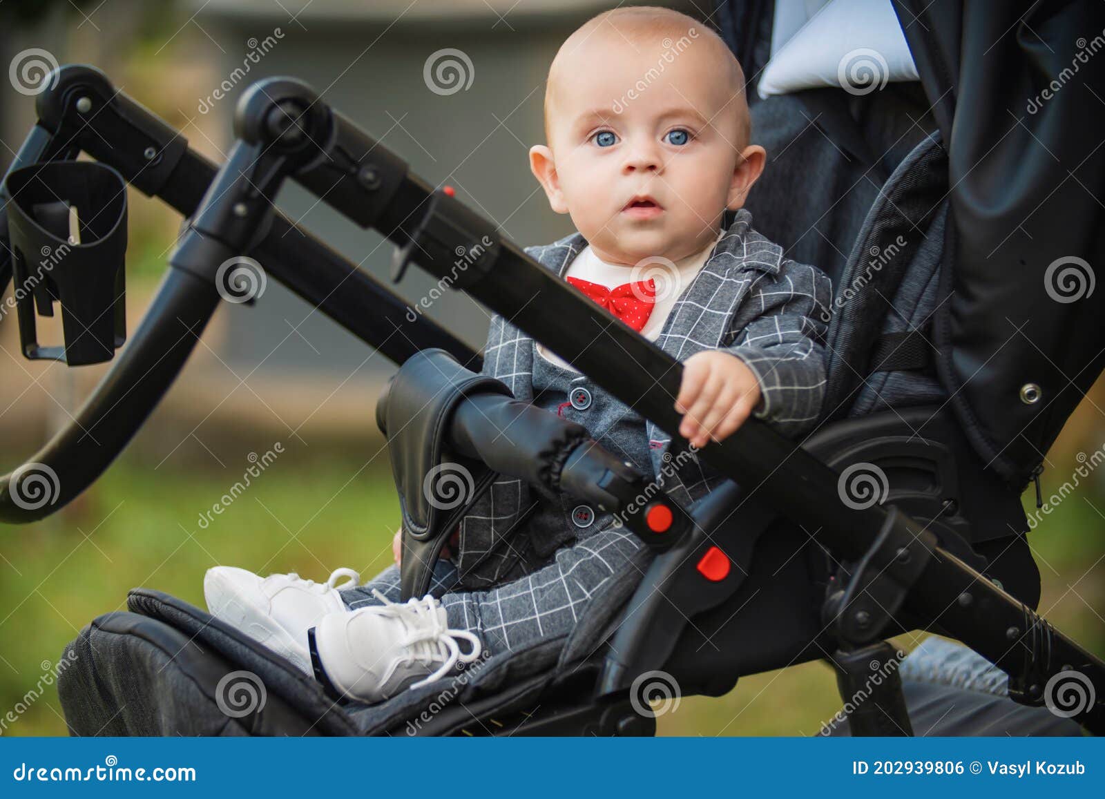 Little Boy Sitting in a Stroller Stock Photo - Image of baby, girl ...