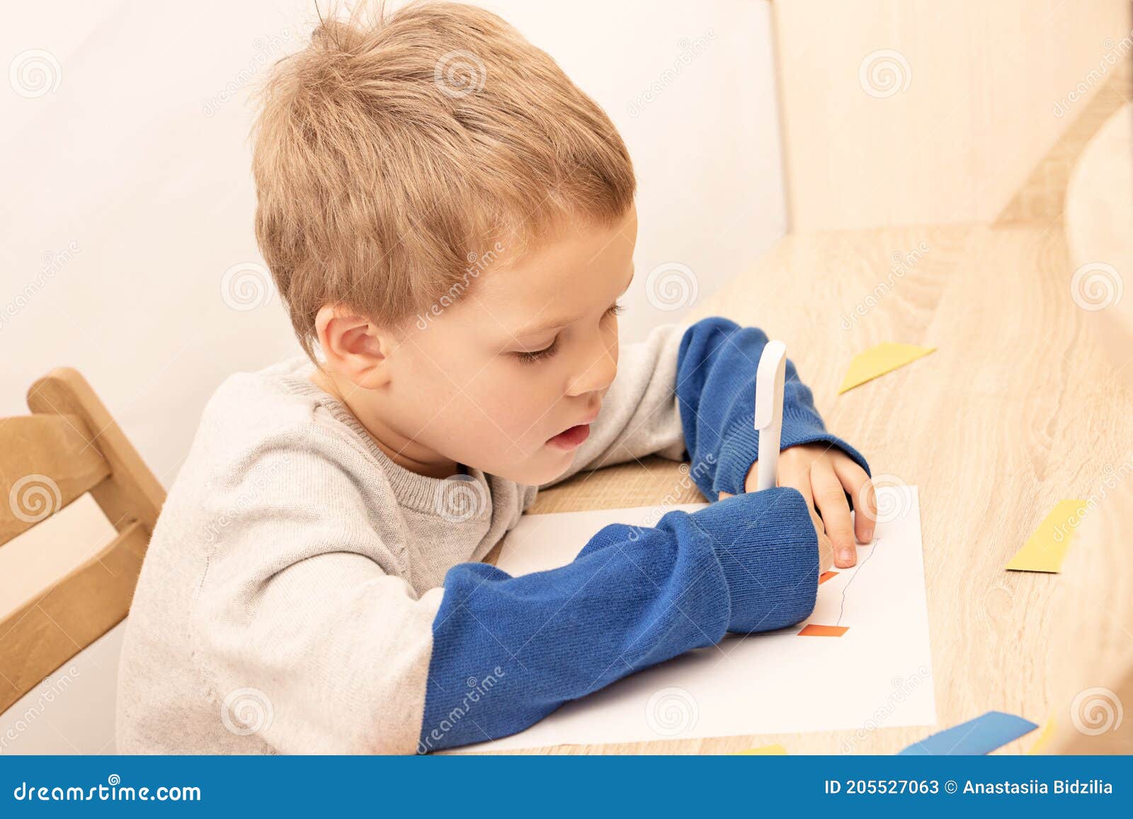 Little Boy Sitting at the Table and Draw..Concept of the Home Education ...
