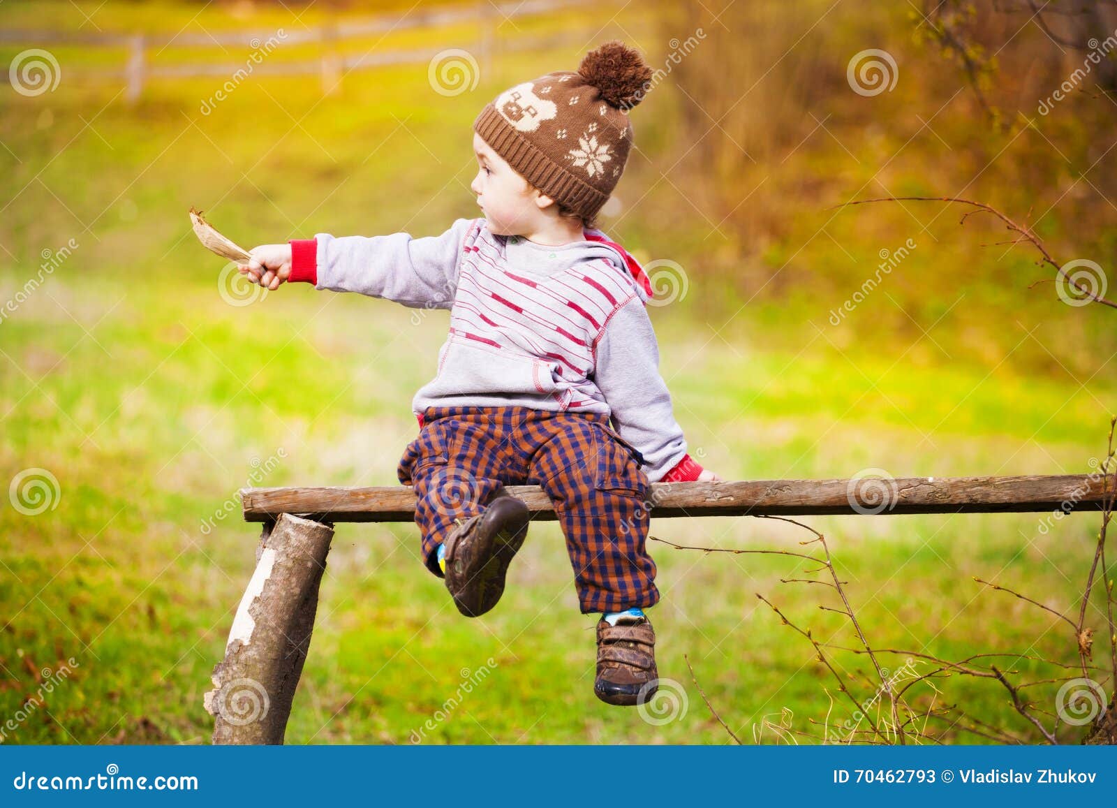 A Little Boy is Sitting Under a Tree. Stock Image - Image of beautiful ...