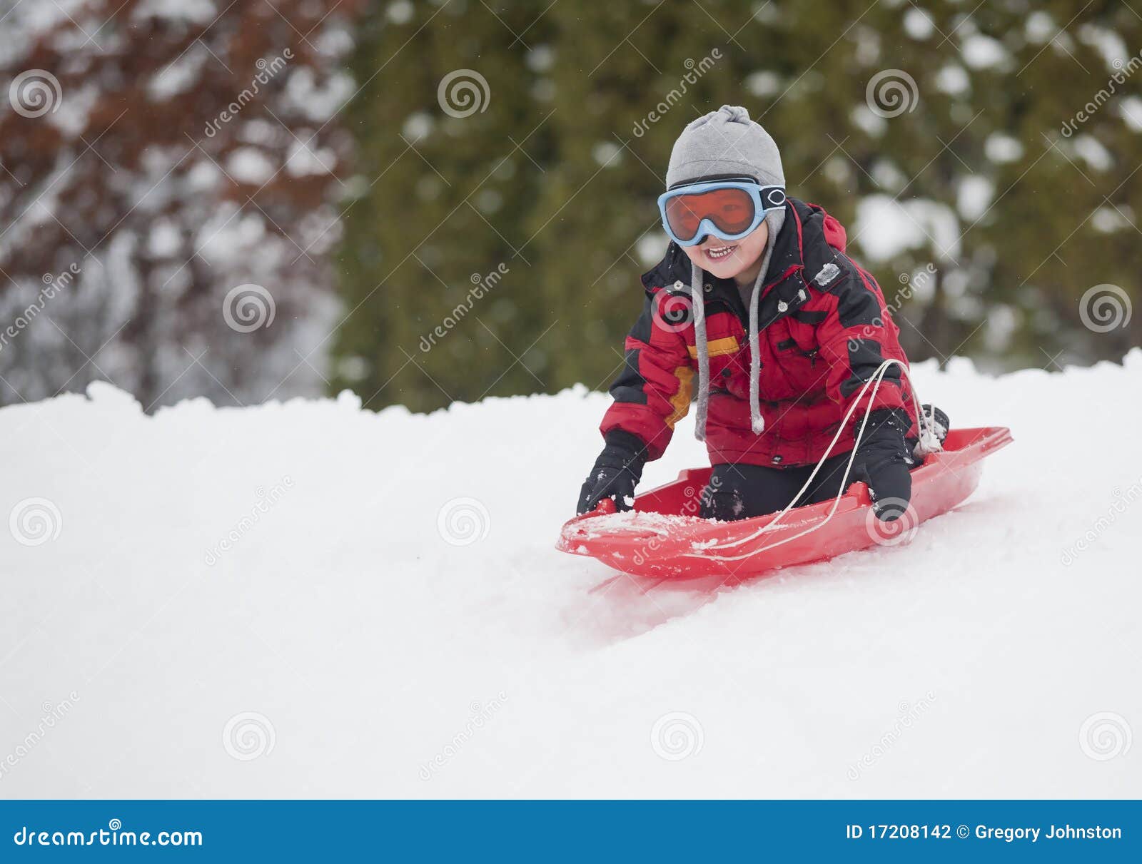 Little boy sledding. stock photo. Image of outdoors, face - 17208142
