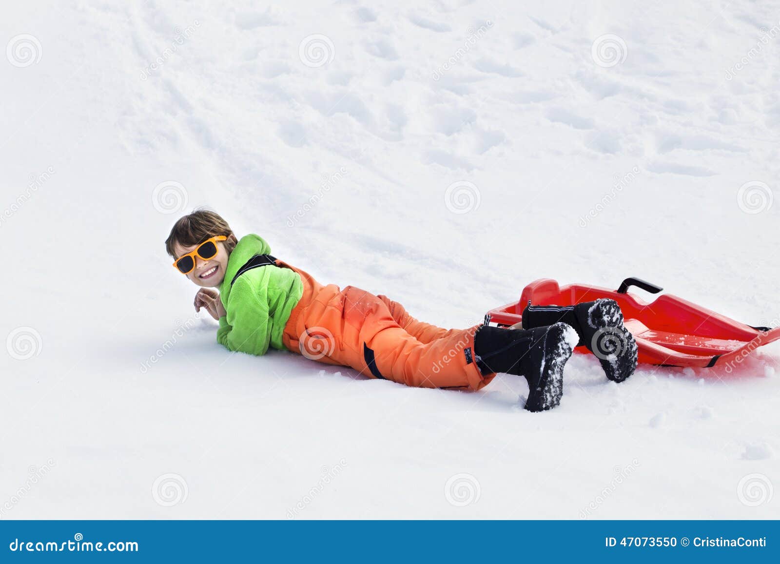 Little Boy Sledding Very Fast and Falls on the Snow Stock Photo - Image ...