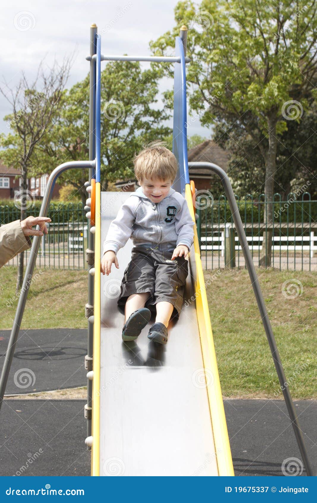 Little Boy Sliding Down a Slide Stock Image - Image of blonde, excited ...
