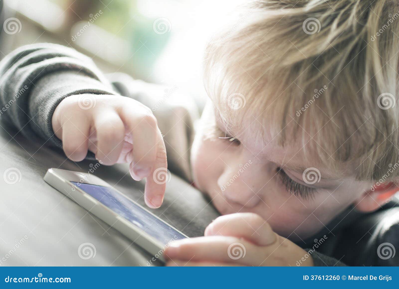 Little boy on smartphone stock photo. Image of kids, modern - 37612260
