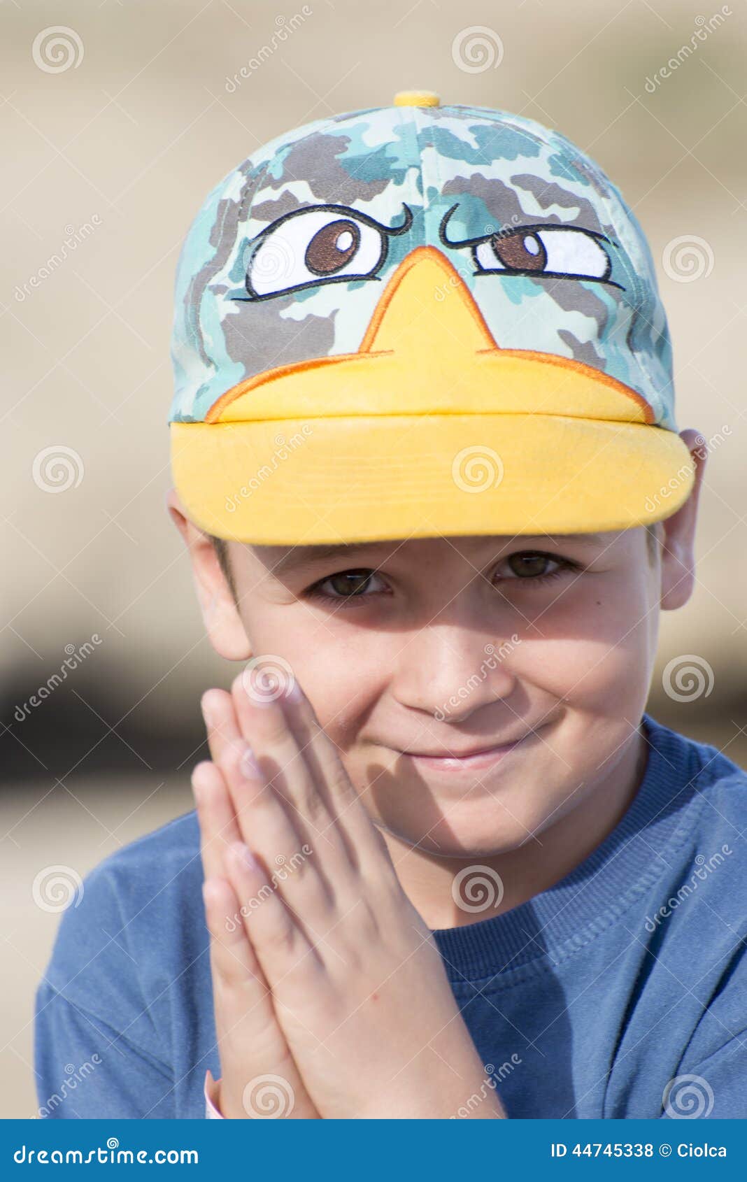 Little Boy Smiling and Begging Stock Photo - Image of smiling, blue ...