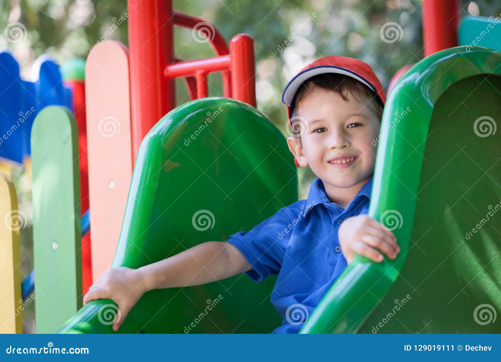 Little Boy Smiling on a Playground Outdoors in Summer. Having Fun on a ...