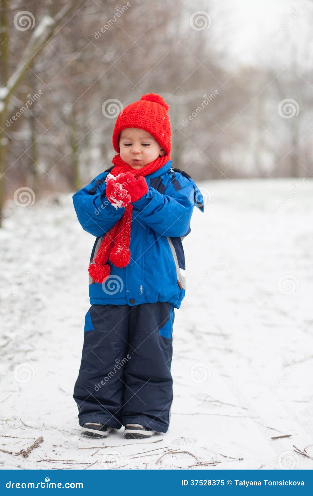 Little boy in the snow stock image. Image of arms, look - 37528375