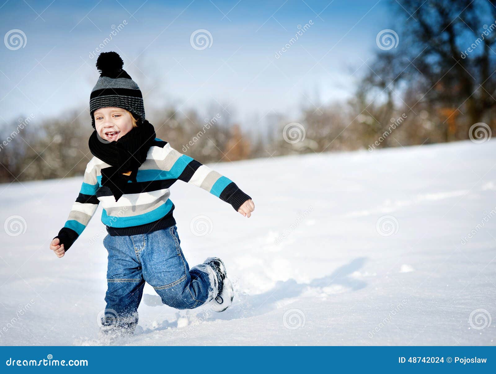 Little boy in the snow. stock photo. Image of snowflake - 48742024