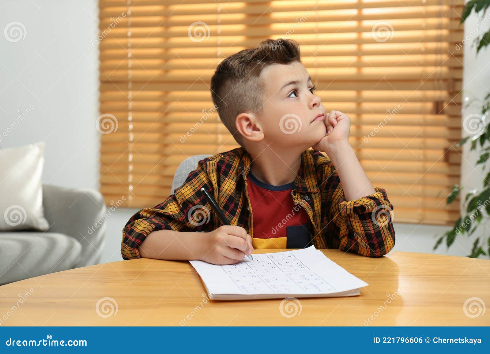 Little Boy Solving Sudoku Puzzle at Table Stock Photo - Image of puzzle ...
