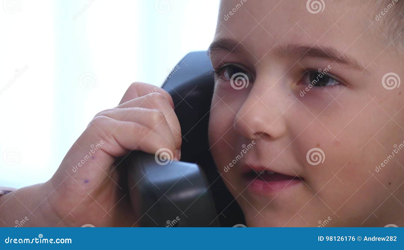 Little Boy Speaking on Phone in the Office. Close Up Stock Photo ...