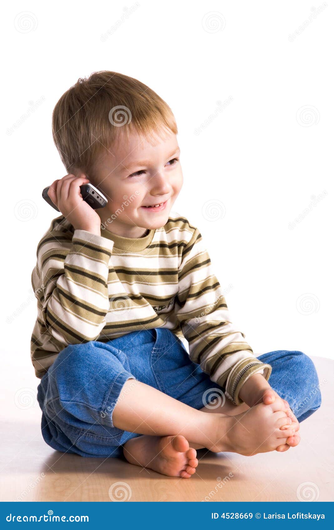 Little boy speaks by phone stock image. Image of playful - 4528669