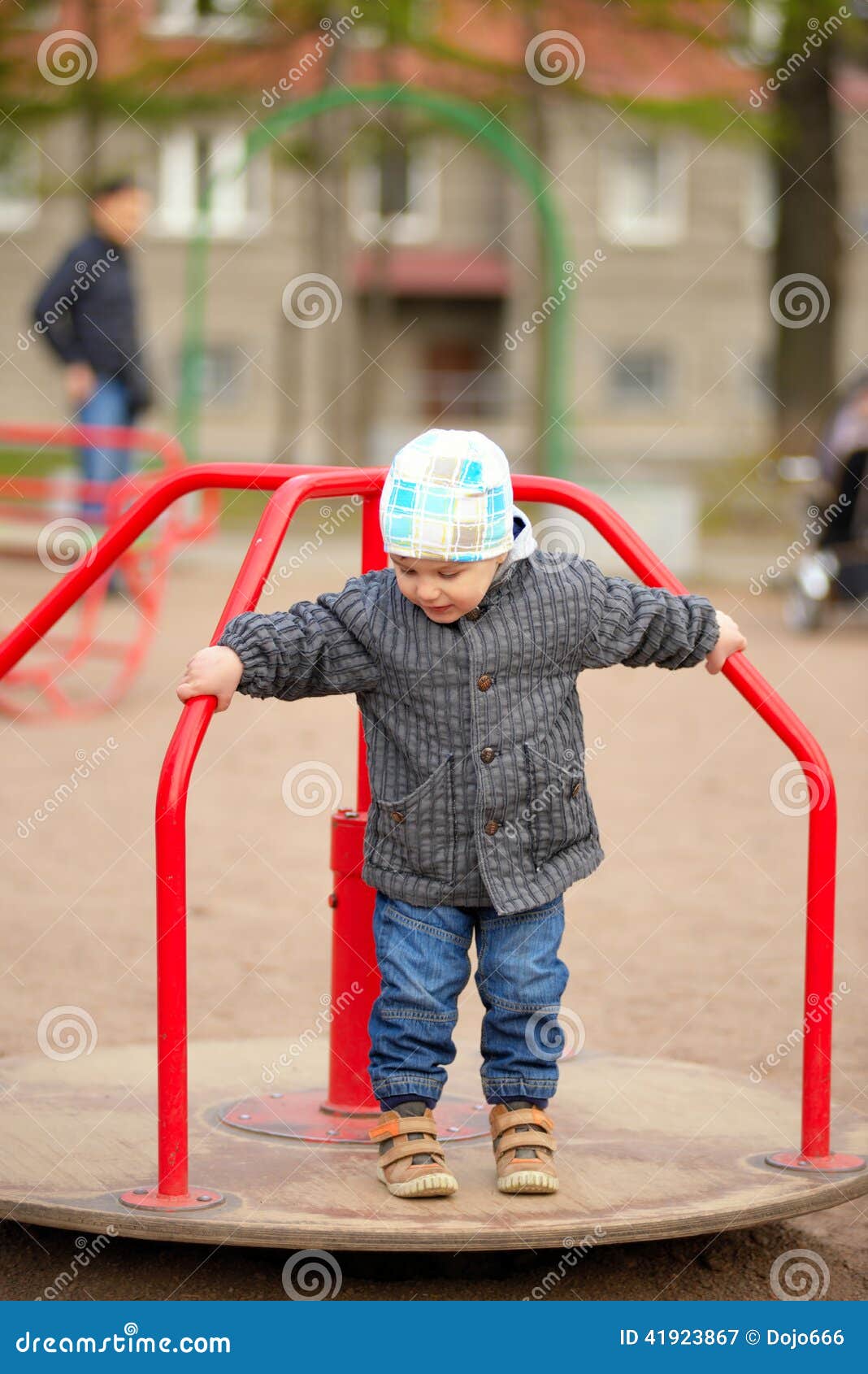 Little Boy Spinning on the Roundabout Stock Image - Image of looking ...