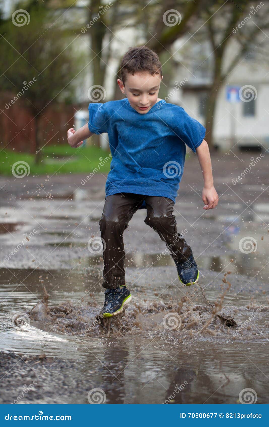 Little Boy Splashing in a Mud Puddle, Stock Image - Image of early ...