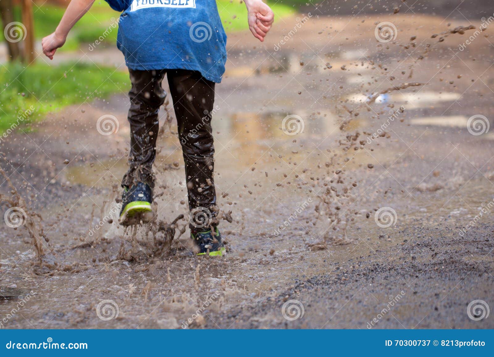 Little Boy Splashing in a Mud Puddle, Stock Image - Image of action ...