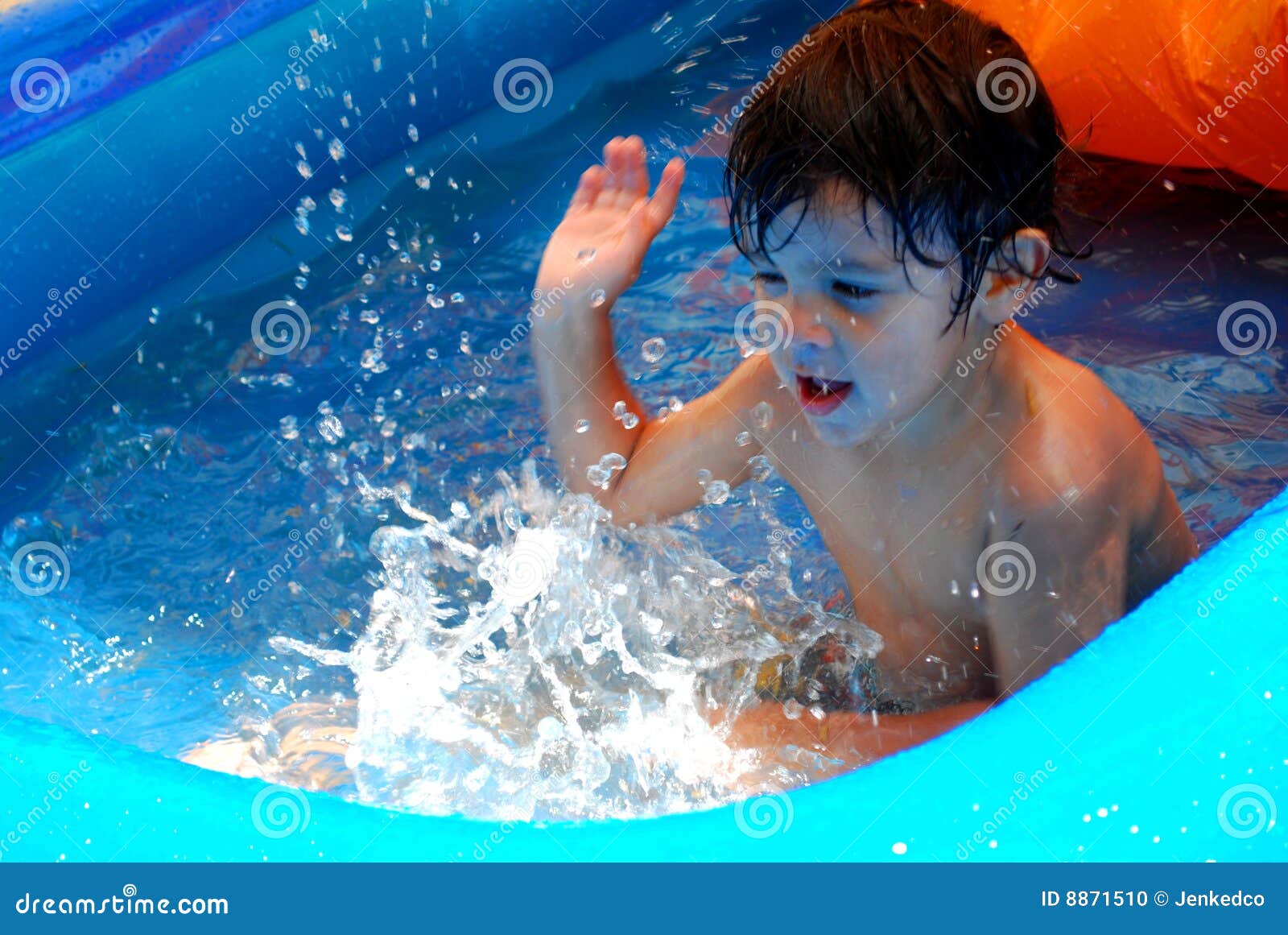 Little Boy Splashing in a Pool Stock Photo - Image of dark, jump: 8871510