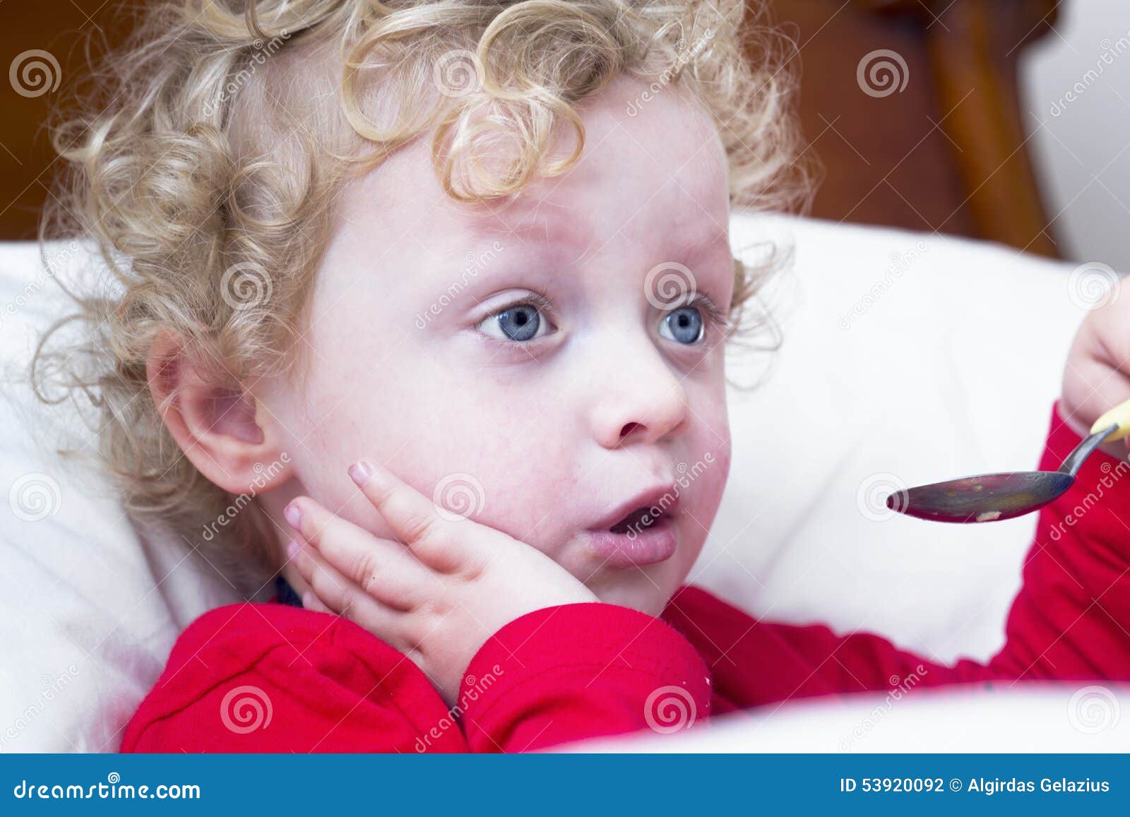 Little Boy with a Spoon in a Bed Stock Photo - Image of child ...