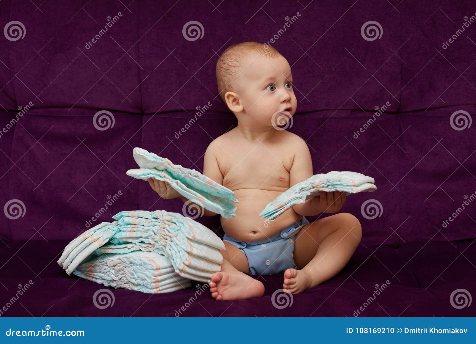Little Boy with Stack of Diapers or Nappies on Purple Background Stock ...