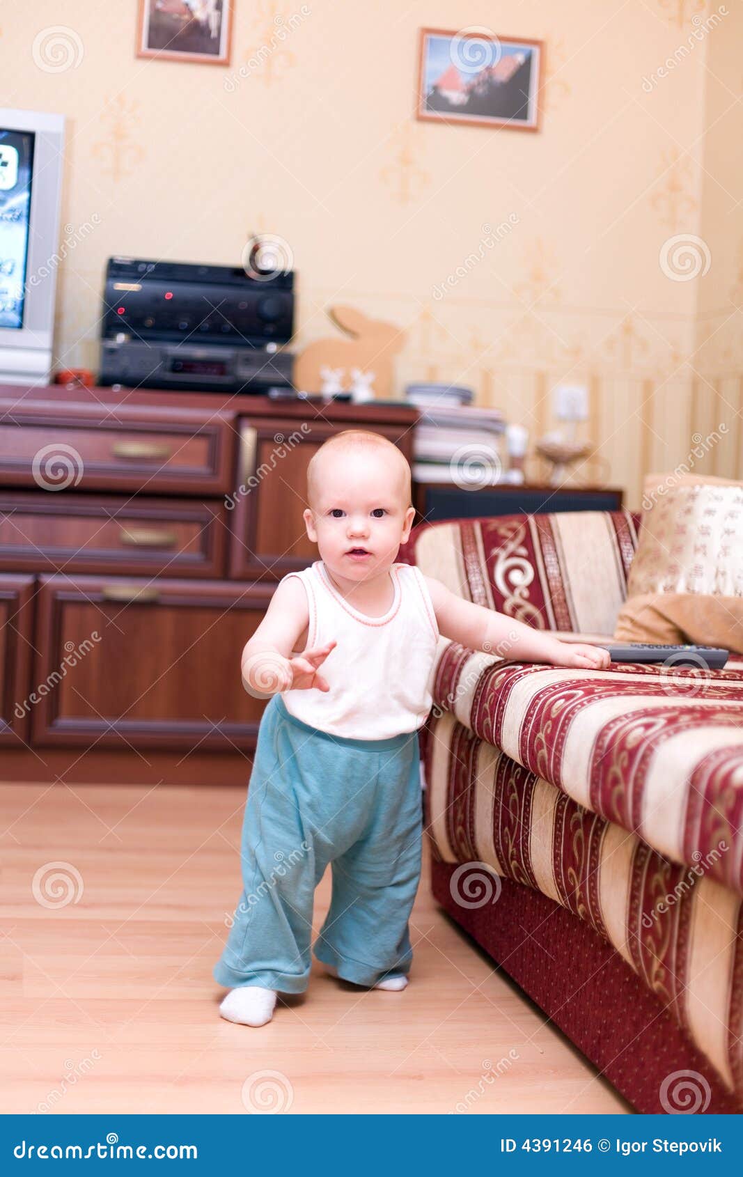 Little Boy Stand on Hardwood Floor in Home Stock Photo - Image of ...