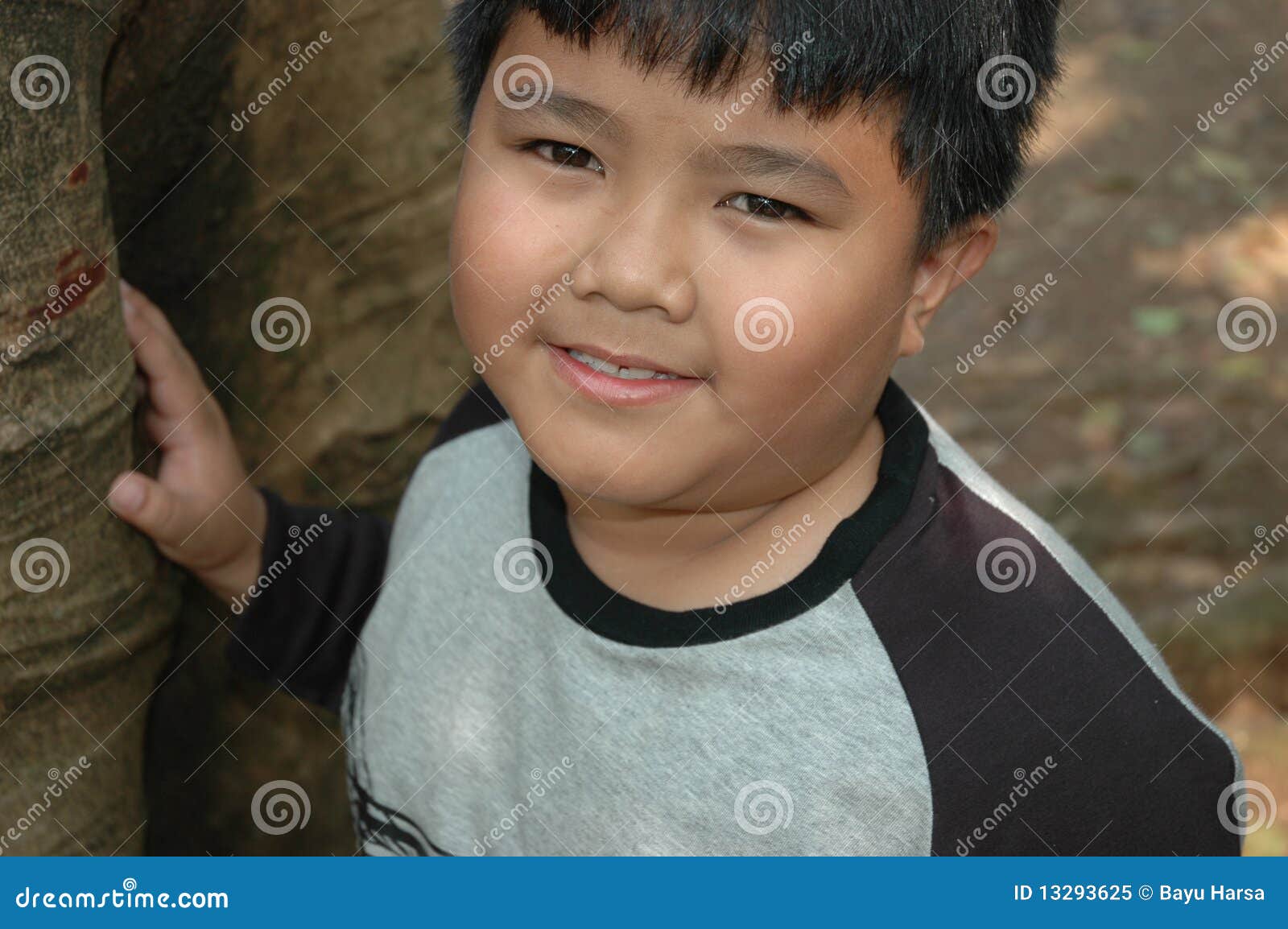 Little Boy Stand Up beside the Tree Stock Image - Image of model, cute ...