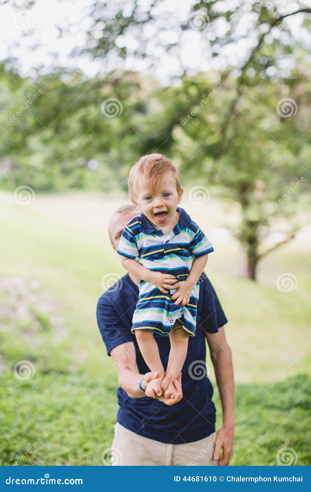 A Little Boy Standing on His Father, Balancing Editorial Image - Image ...