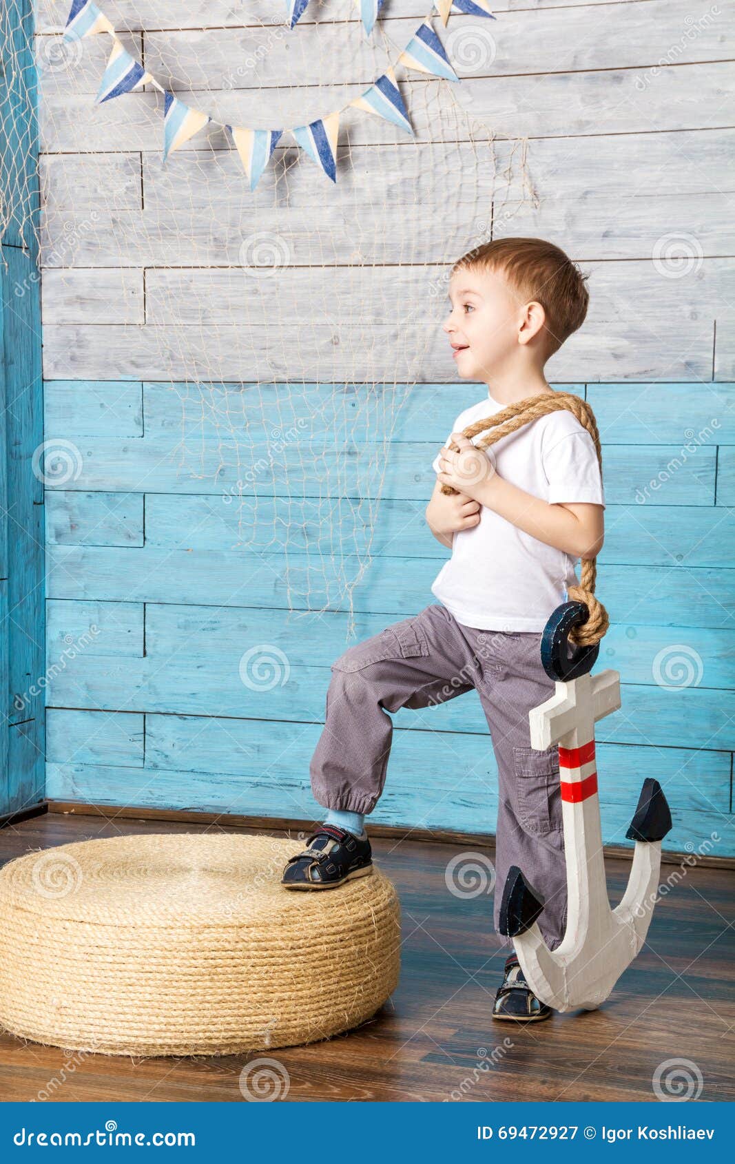 Little Boy Standing and Holding an Anchor Stock Image - Image of ...