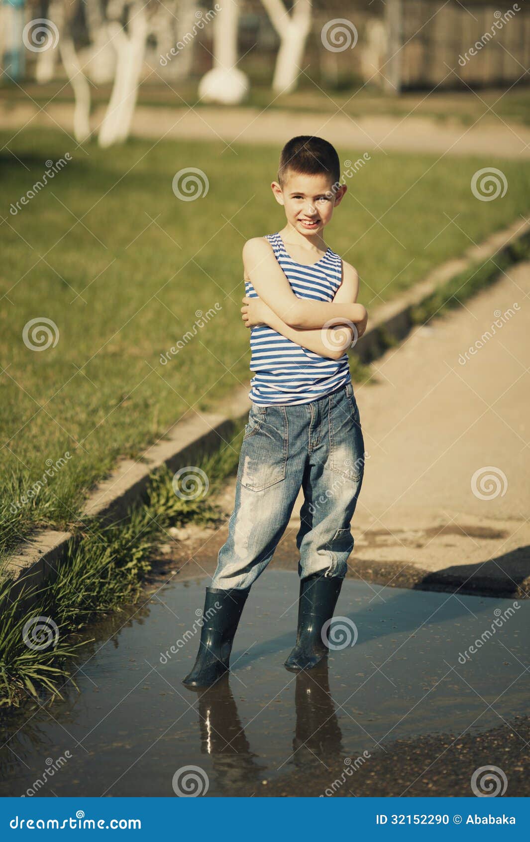 Little Boy Standing in Puddle Stock Photo - Image of spring, children ...
