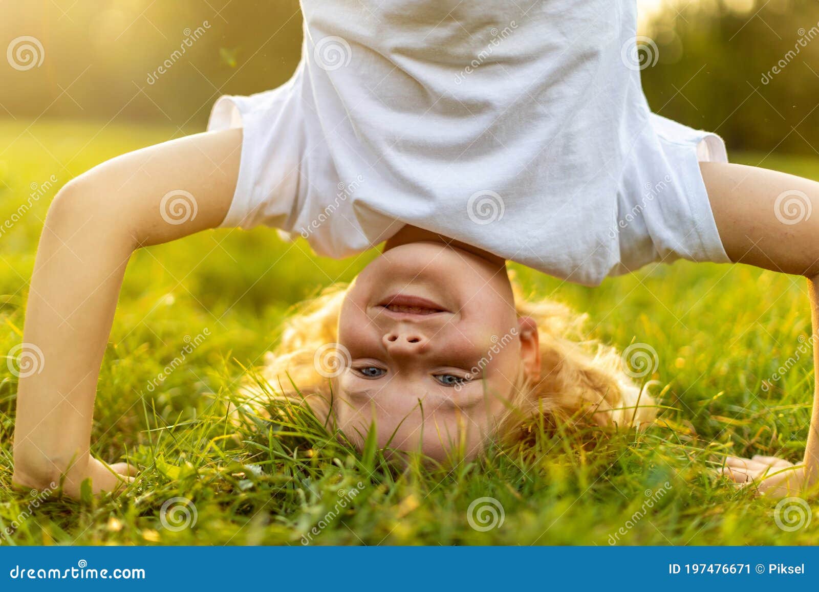 Child Doing Headstand in Park Stock Image - Image of outdoors, hand ...