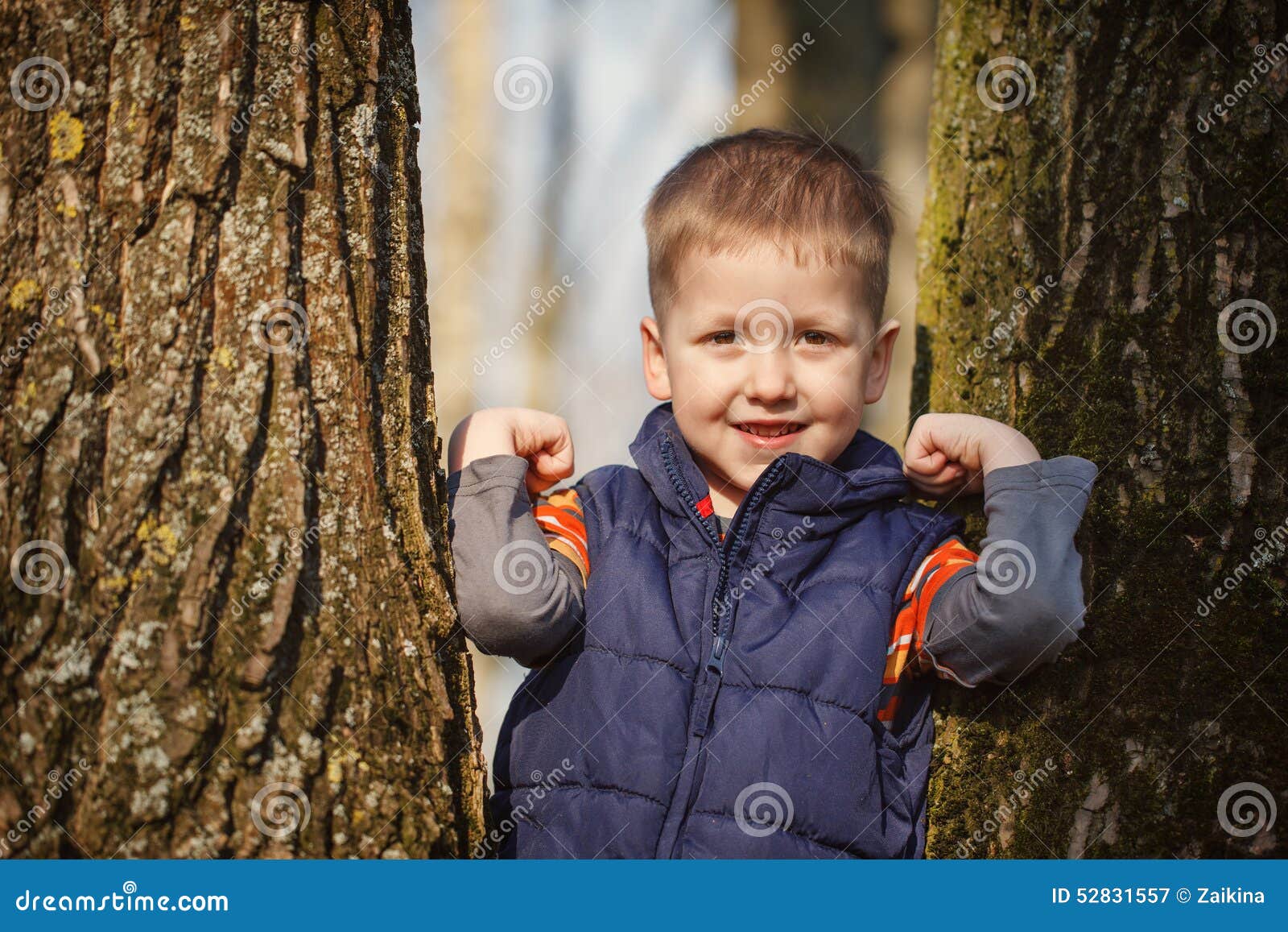 Little Boy Stands among the Trees Stock Image - Image of color, brown ...