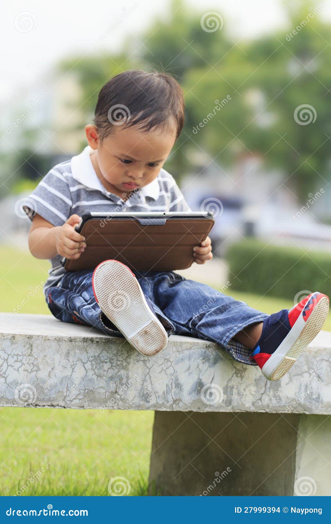 Little Boy Staring At A Tablet Stock Photo - Image of beautiful ...