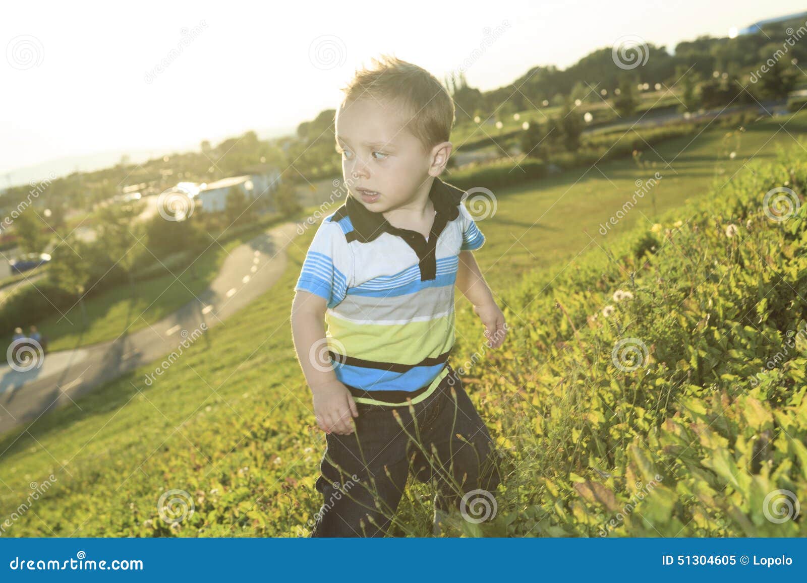 Little Boy at the Sunset in a Field Stock Image - Image of small, child ...