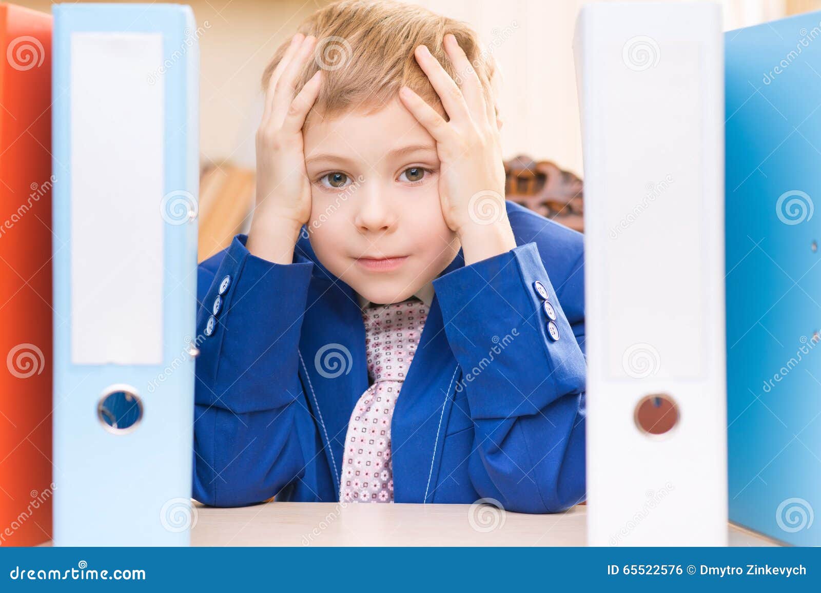 Little Boy Surrounded by Large Folders Stock Photo - Image of childhood ...