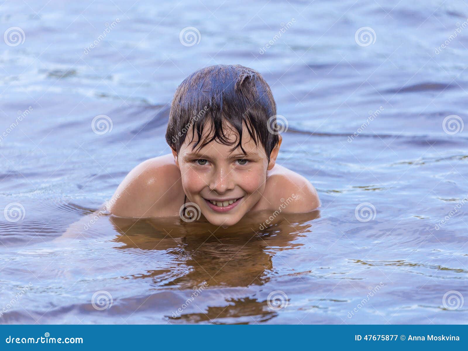 Boy Swimming In Lake