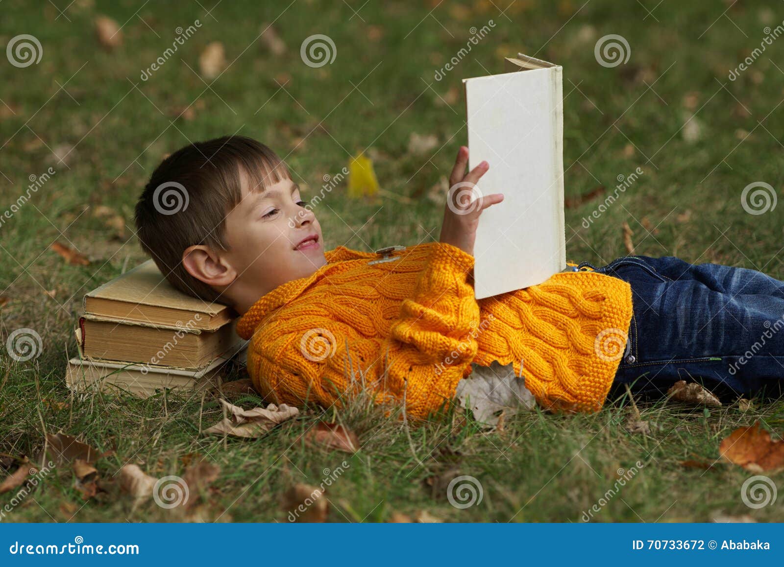 Little Boy Sying on Stack of Books Stock Photo - Image of books, travel ...