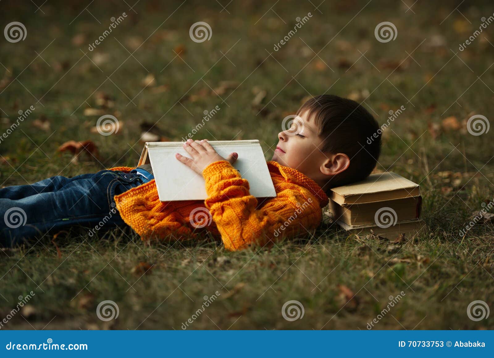 Little Boy Sying on Stack of Books Stock Image - Image of learning ...