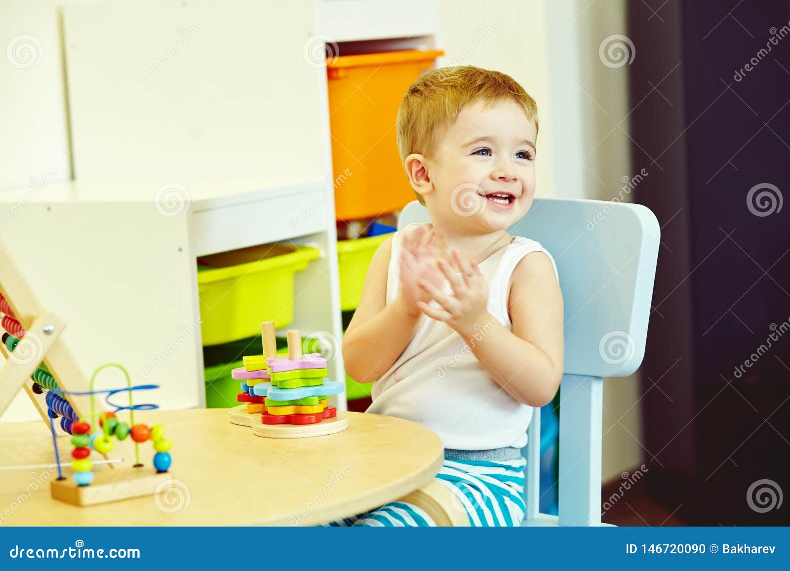 Little Boy at the Table Playing in Developing Game Stock Photo - Image ...