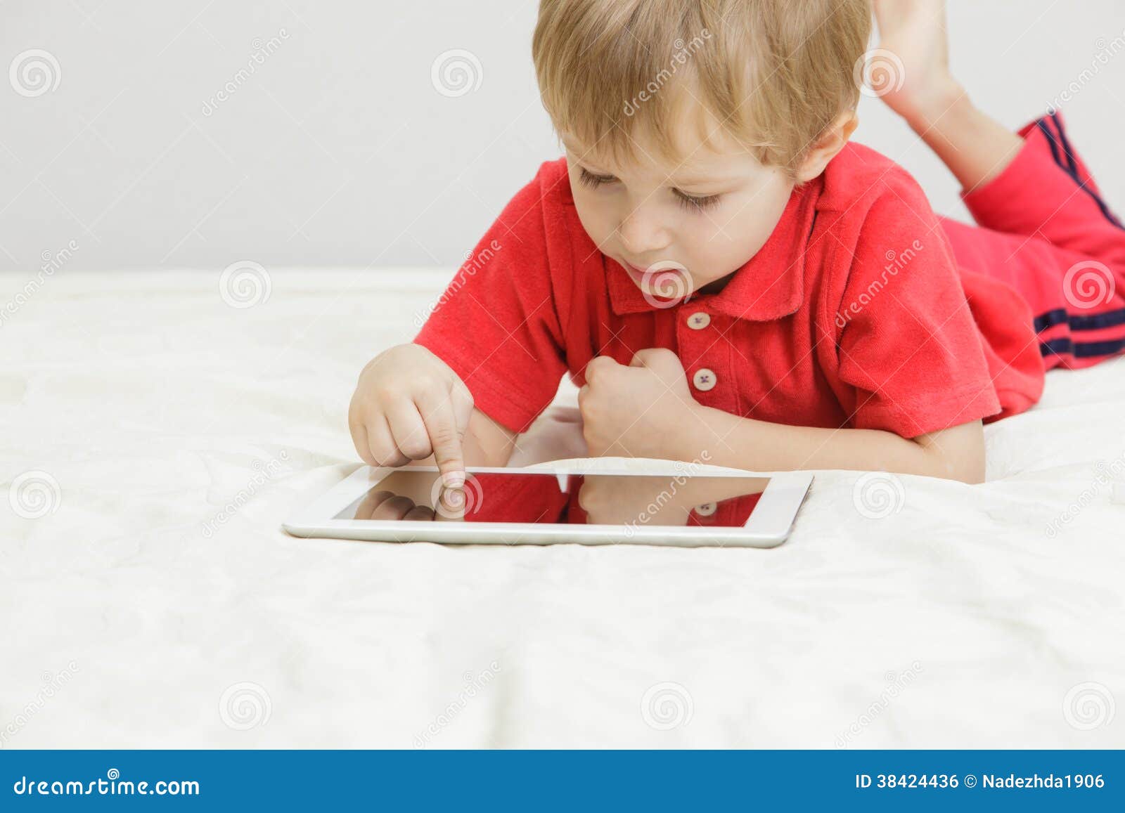Little boy with tablet stock photo. Image of laptop, bedroom - 38424436