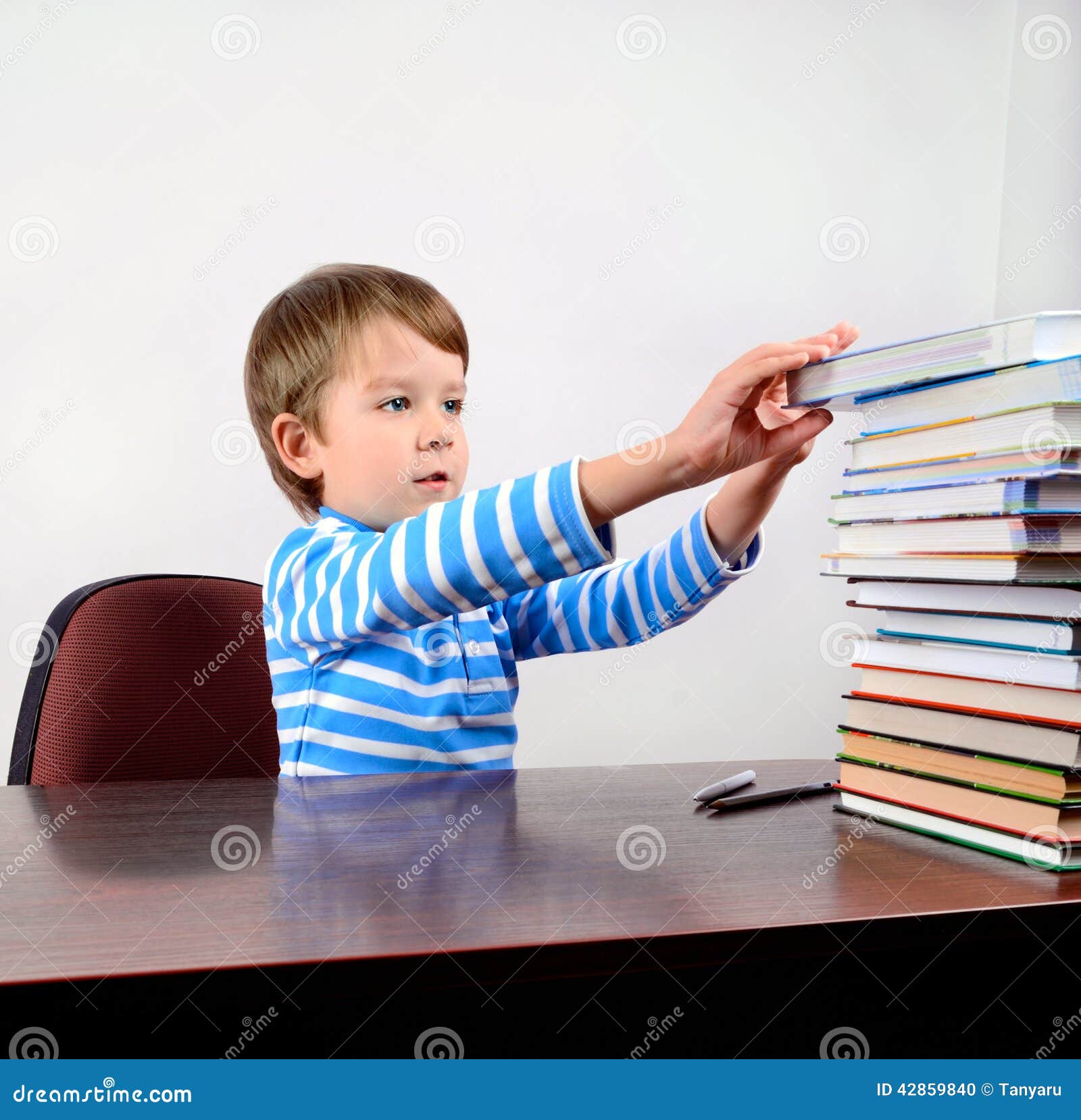 Little Boy Takes Book Stack Stock Photos - Free & Royalty-Free Stock ...