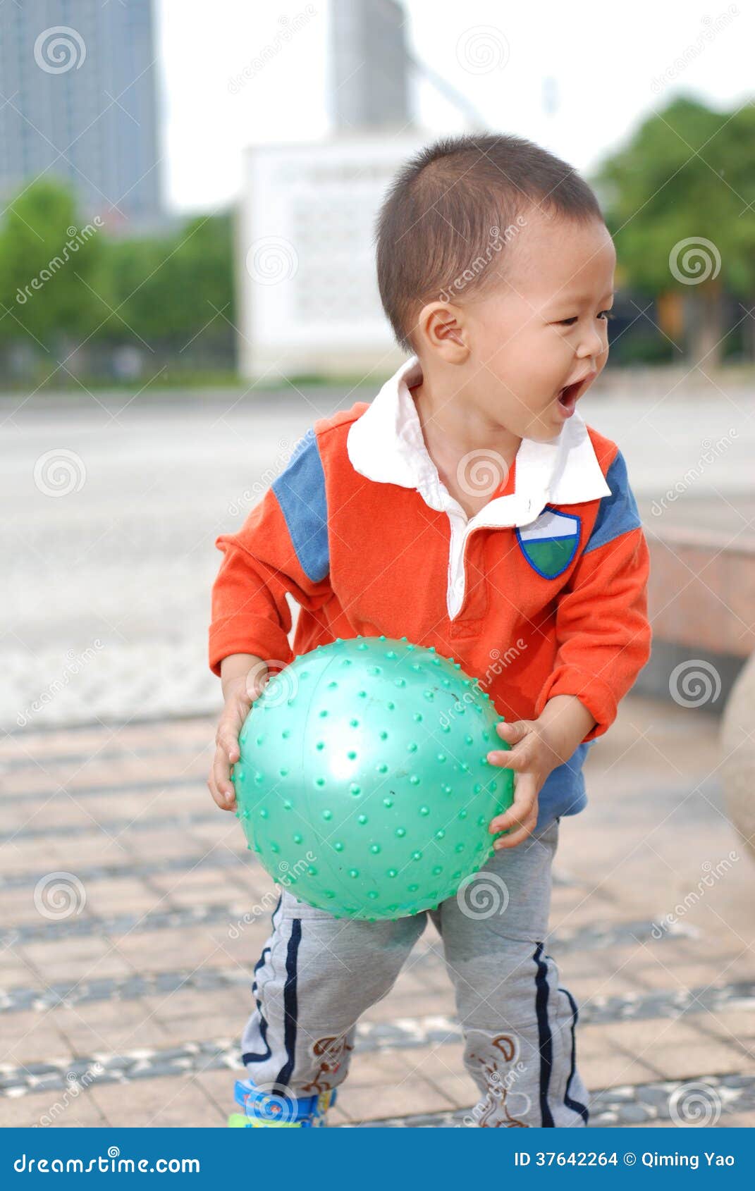 Little boy taking a ball stock photo. Image of orange - 37642264