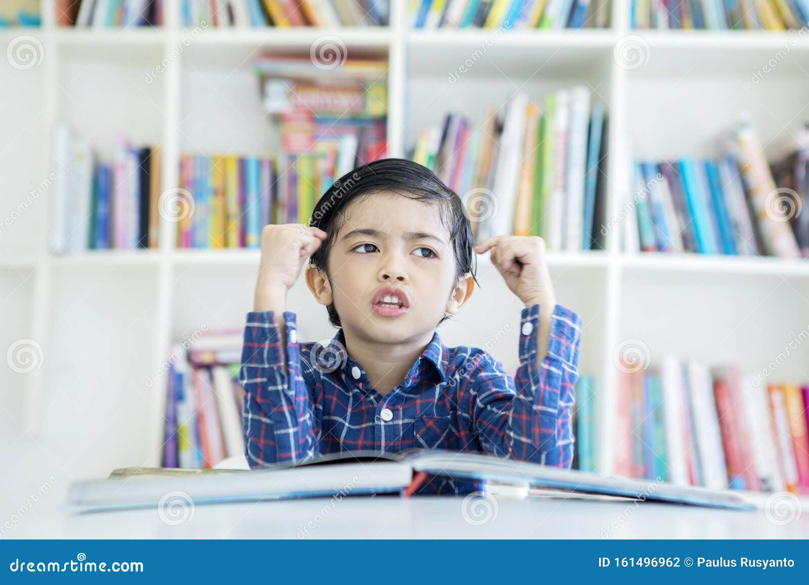 Little Boy Thinking Something in the Library Stock Photo - Image of ...