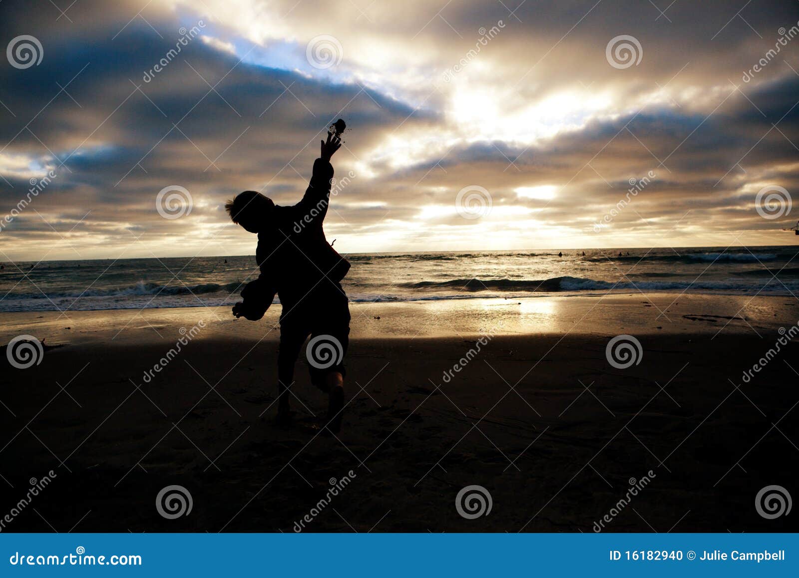 Little Boy Throwing Sand at the Beach Stock Photo - Image of coastal ...