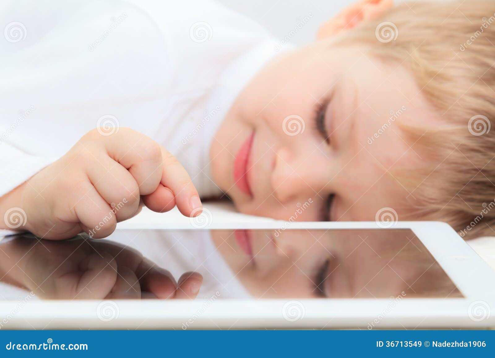 Little boy with touch pad stock image. Image of finger - 36713549
