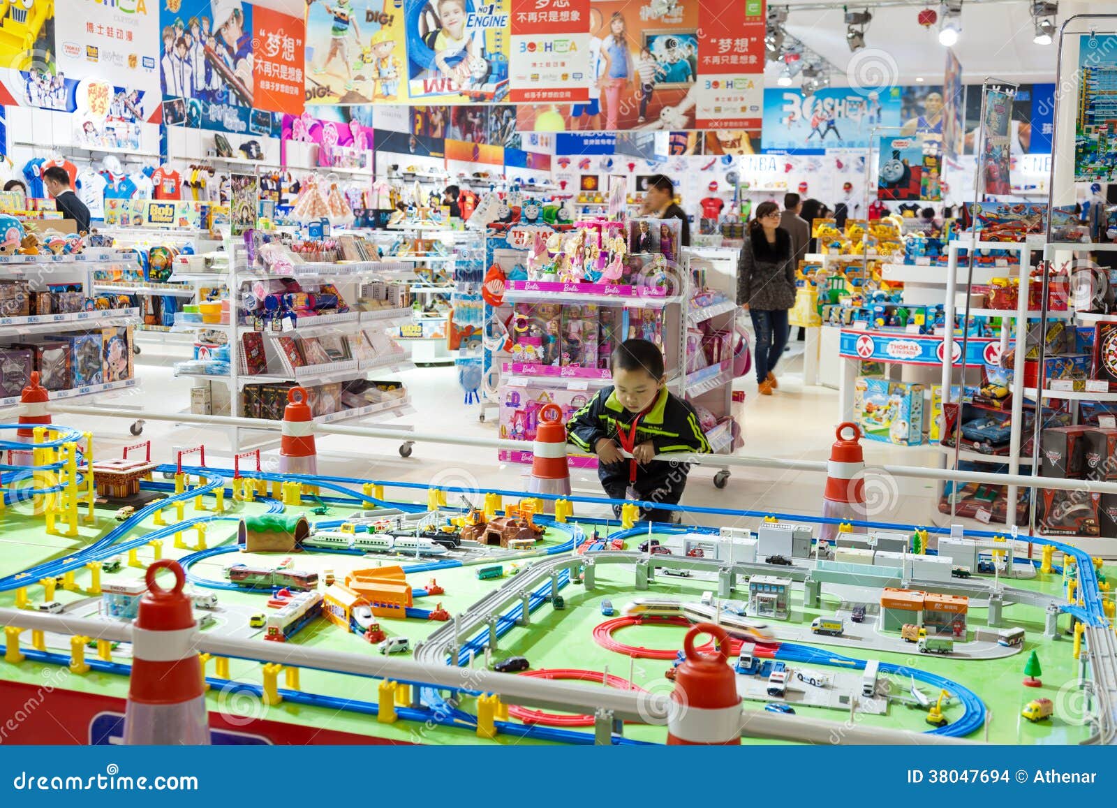 Little boy in toy store editorial stock image. Image of merchandise ...