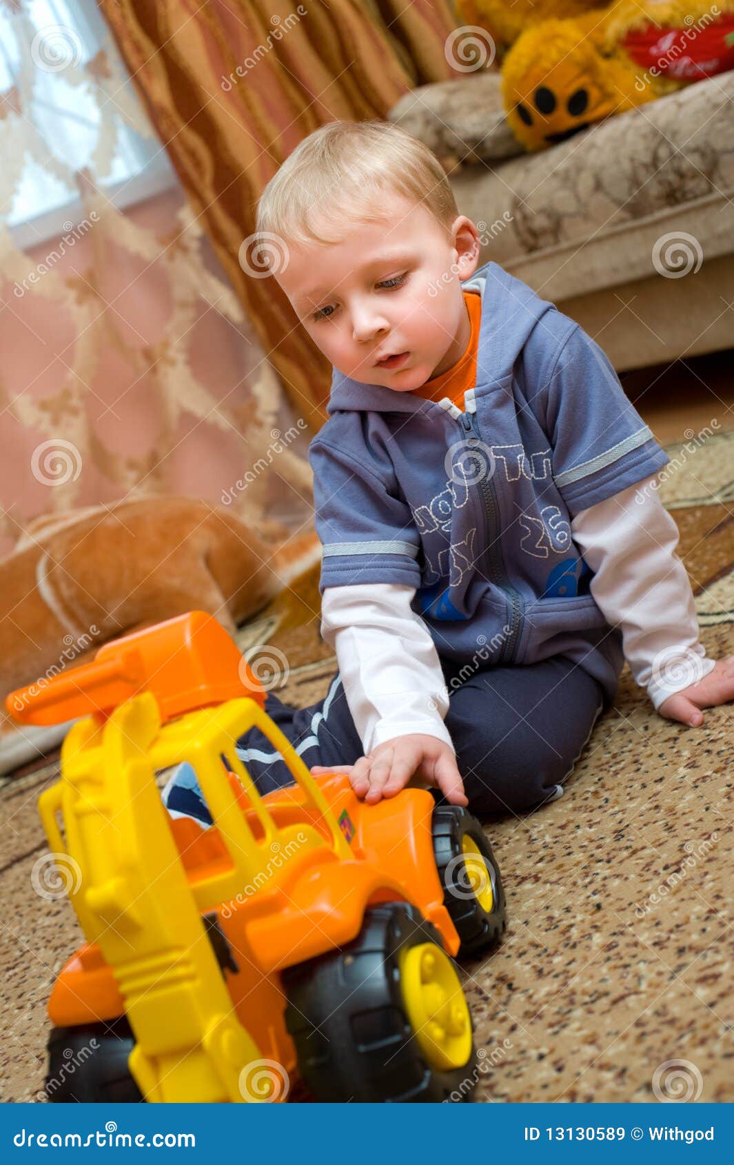 Little boy with toy truck stock image. Image of orange - 13130589