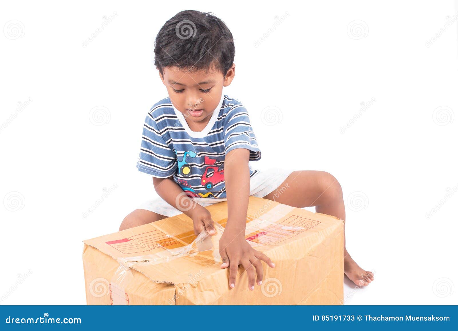 Little boy trying open box stock image. Image of wait - 85191733
